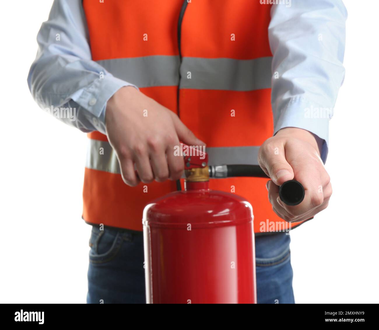 Worker using fire extinguisher on white background, closeup Stock Photo ...