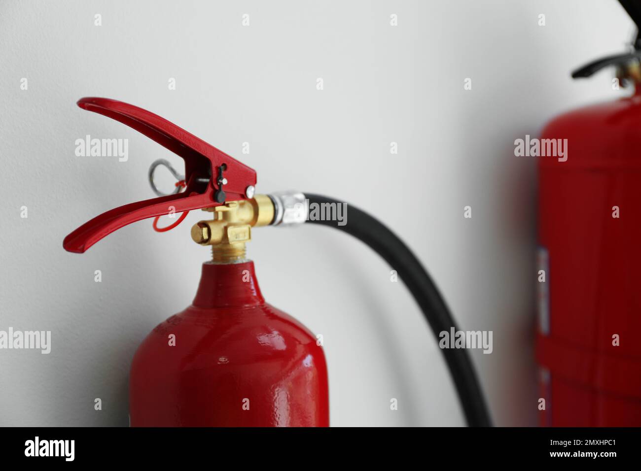 Fire extinguisher on white background, closeup view Stock Photo - Alamy