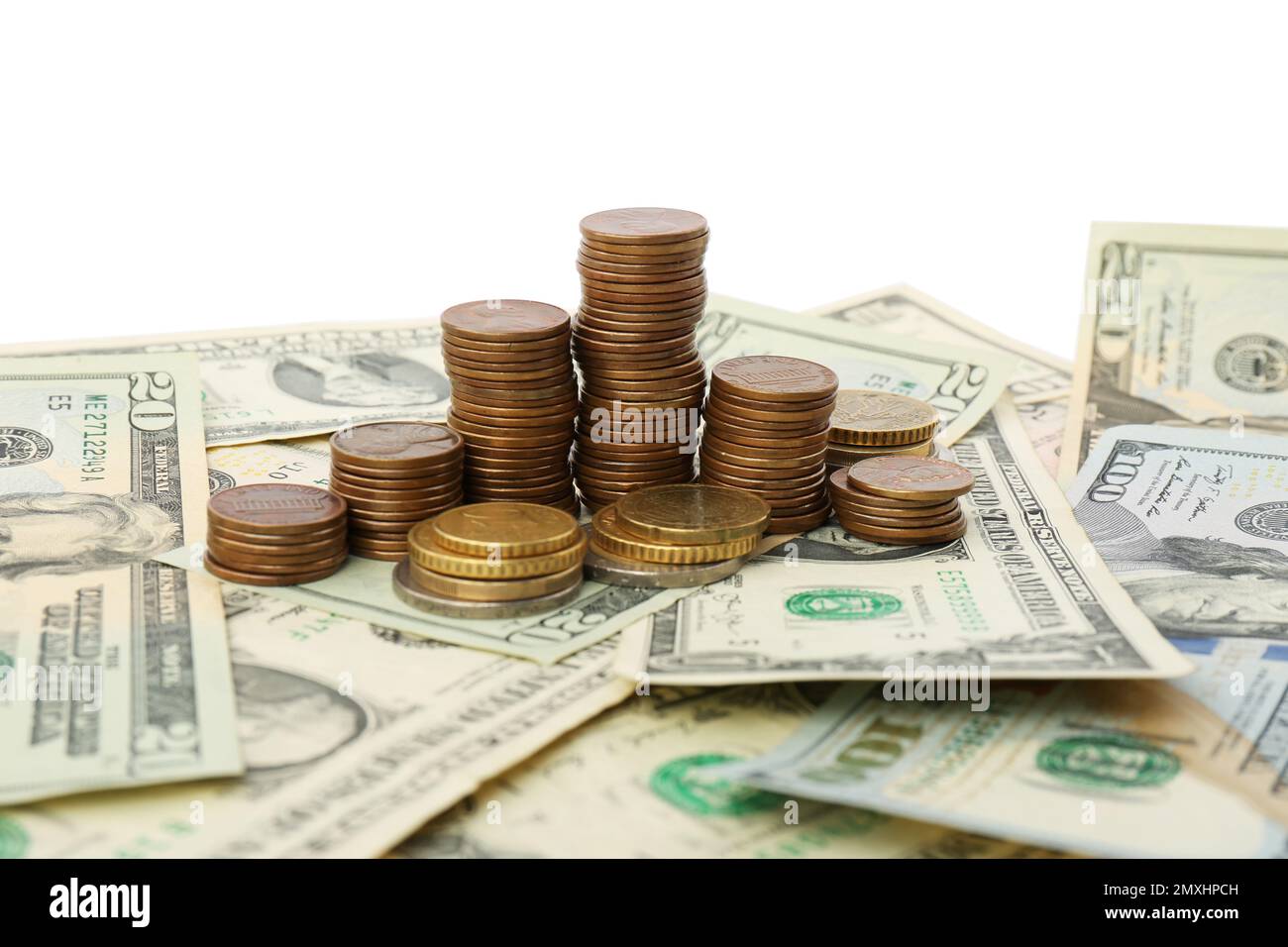Dollar bills and coins on white background Stock Photo - Alamy