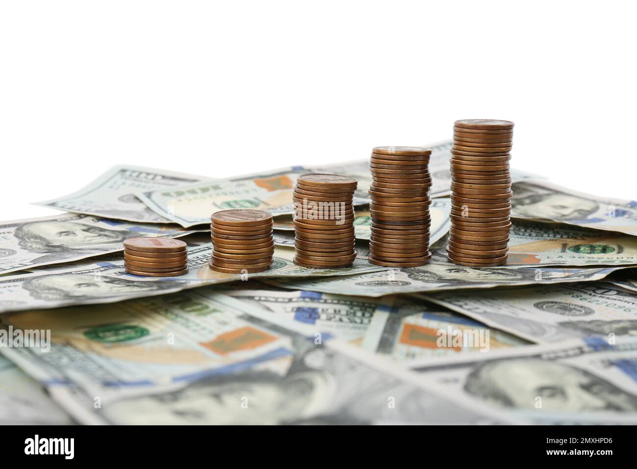 Dollar bills and coins on white background Stock Photo - Alamy