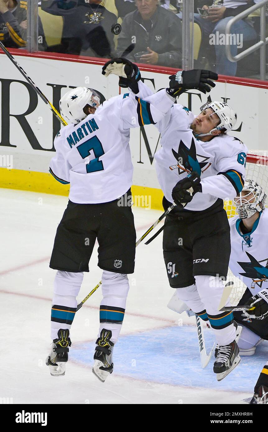 San Jose Sharks defensemen Paul Martin (7) Justin Braun (61) jump up to ...