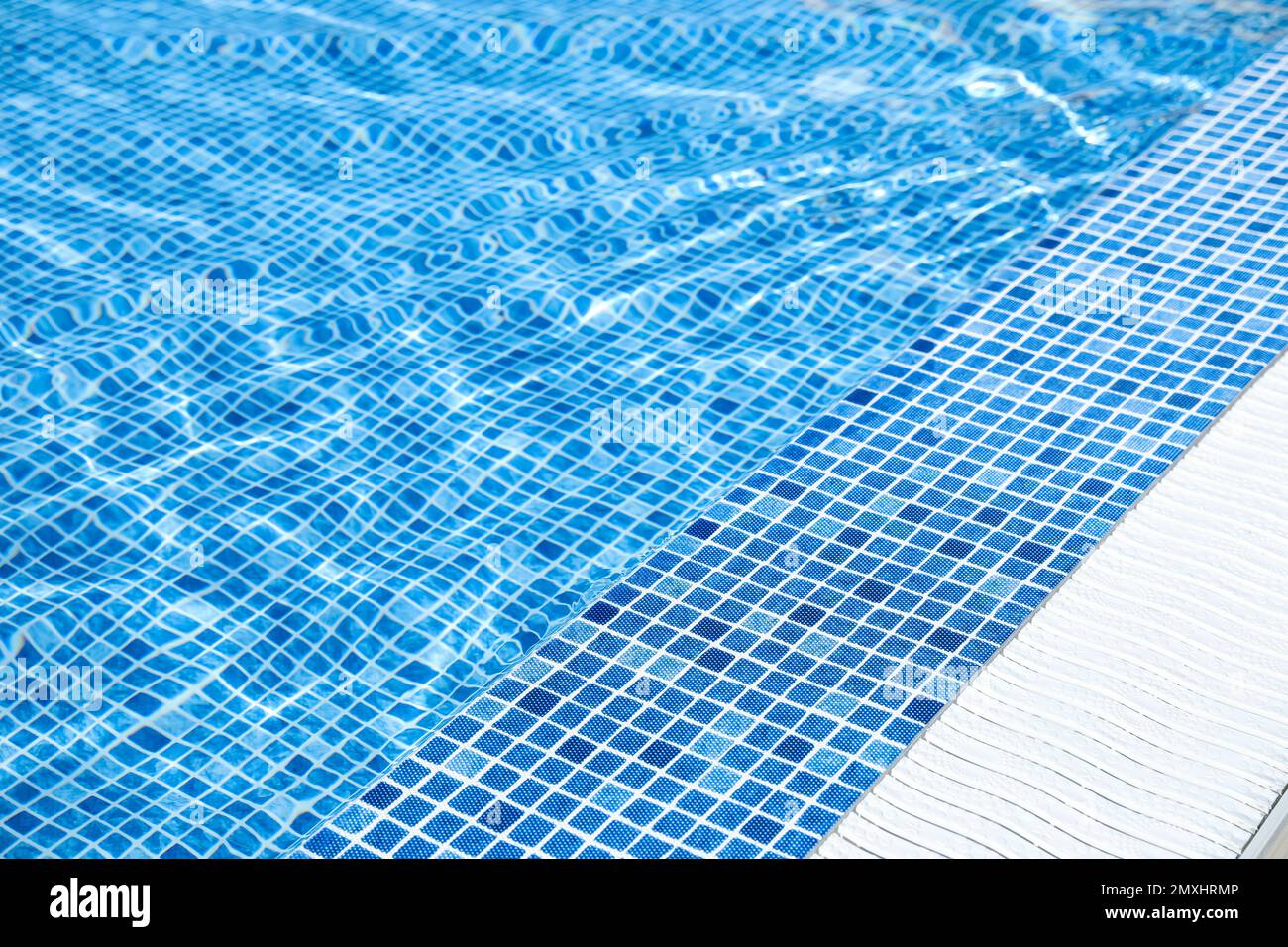 Outdoor swimming pool with clear water on sunny day. Summer vacation ...