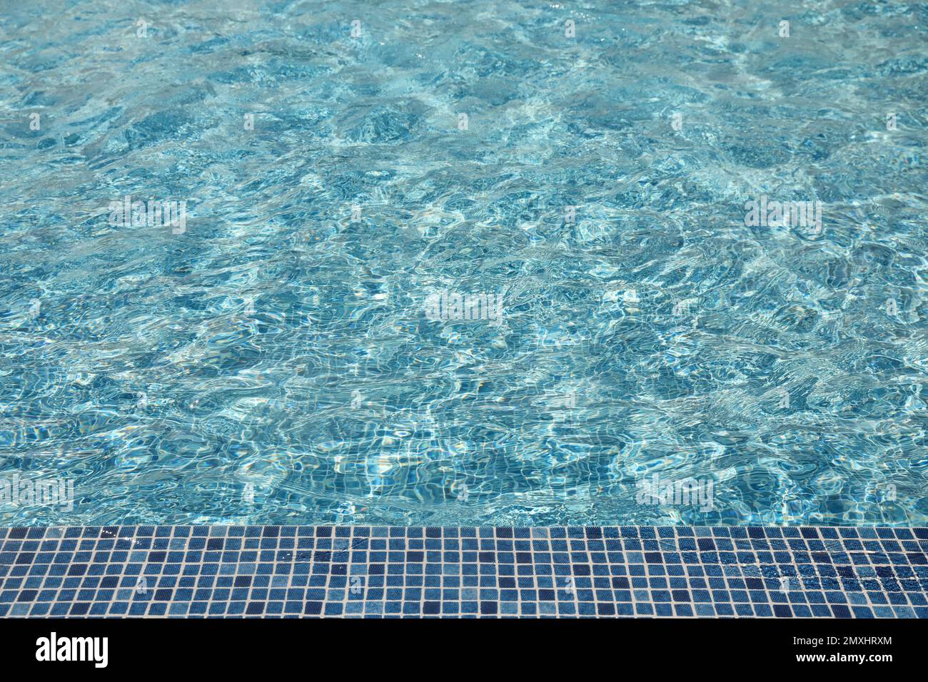 Swimming pool with clean blue water. Summer vacation Stock Photo - Alamy