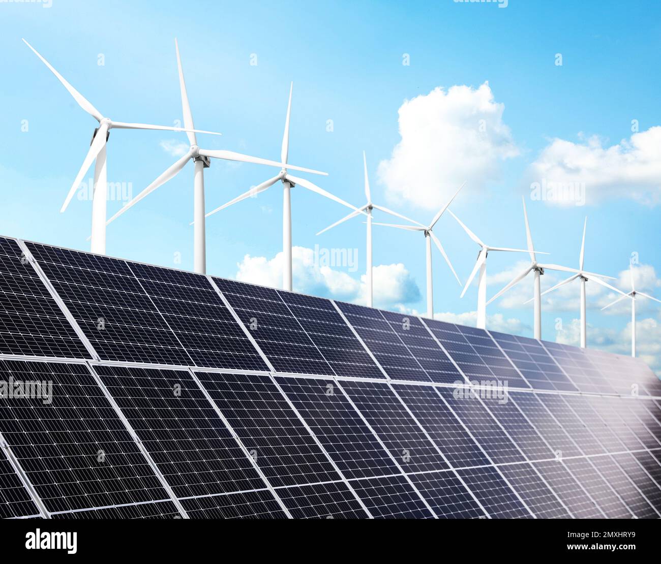 Solar panels and wind turbines installed outdoors. Alternative energy ...