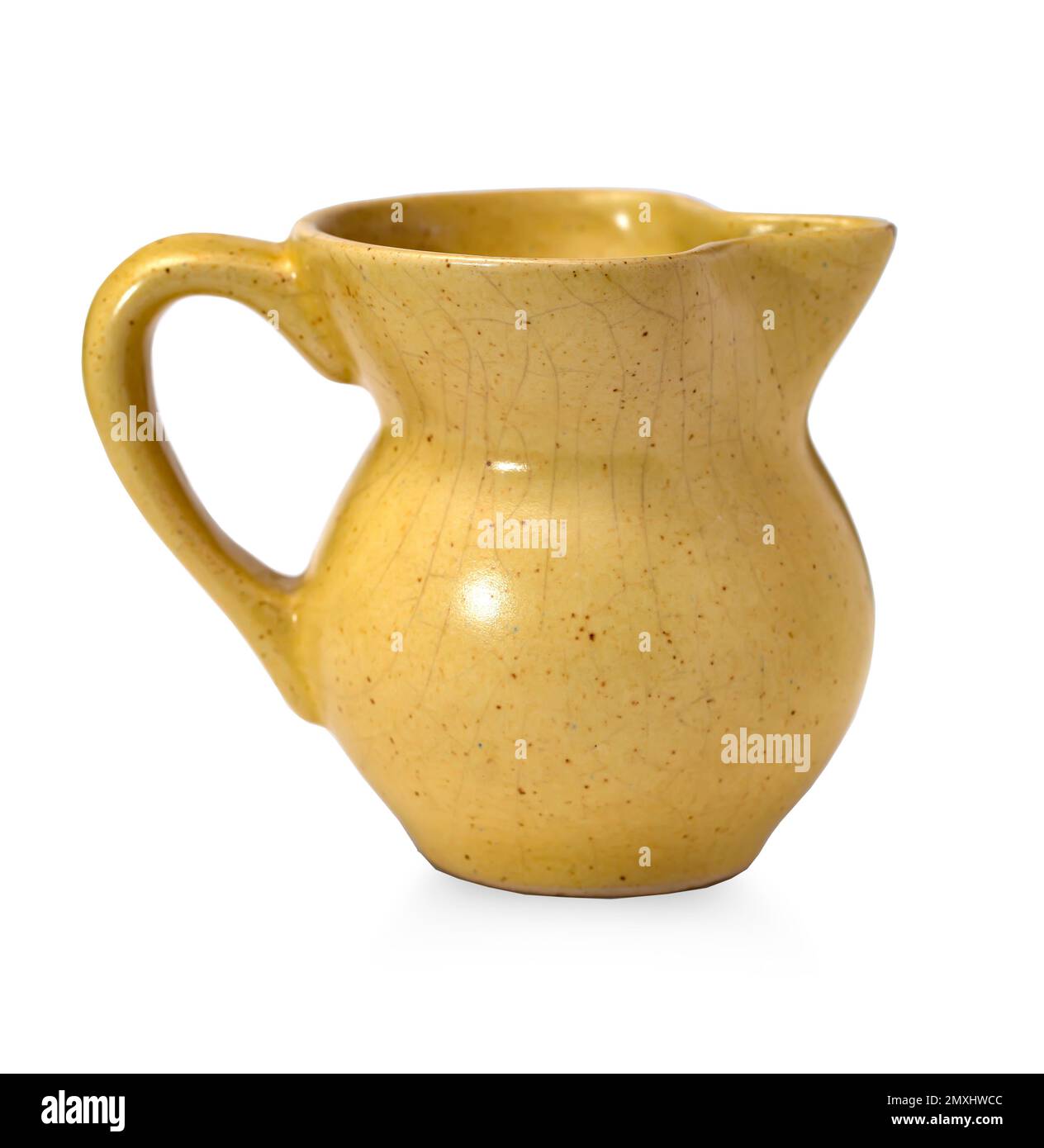 The earthenware yellow jug isolated on white background Stock Photo - Alamy