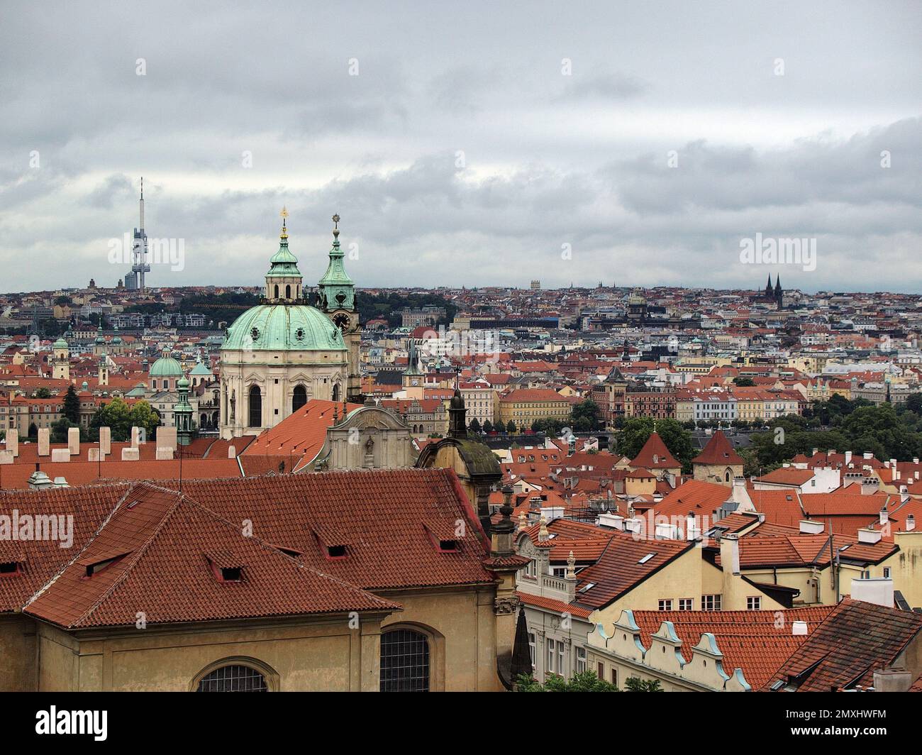 The beautiful cityscape and castle of Prague with overcast clouds above ...