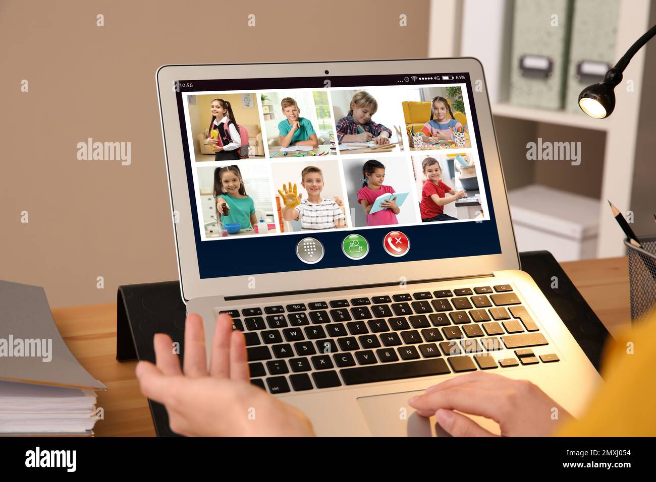 Teacher giving online school lesson during quarantine and social ...