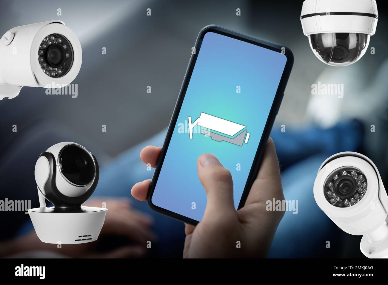 Man using CCTV app on smartphone indoors, closeup Stock Photo - Alamy