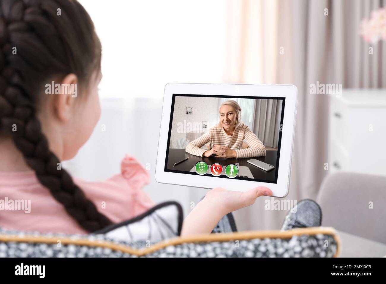 Distance learning, studying at home. Girl having online school lesson ...