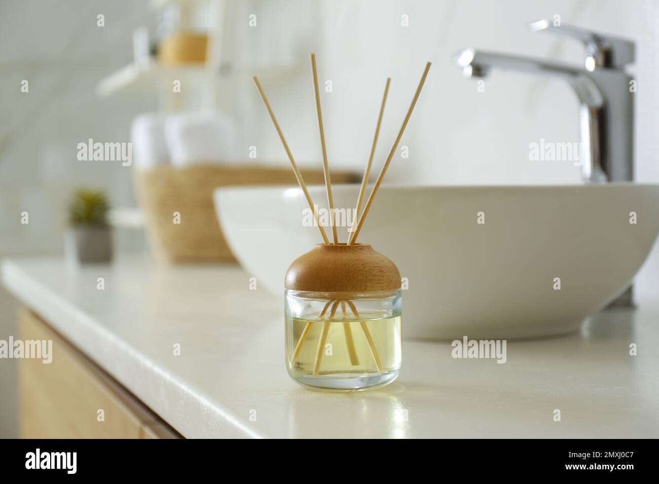 Reed air freshener on counter in bathroom Stock Photo - Alamy