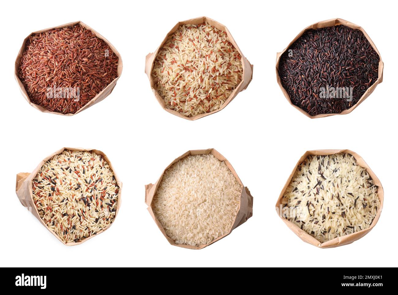 Set with different types of rice in paper bags on white background, top ...