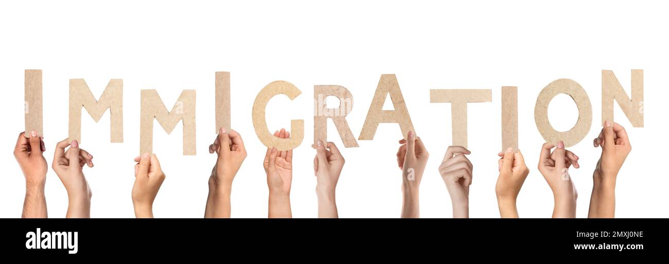 People holding word IMMIGRATION made of cardboard letters on white ...