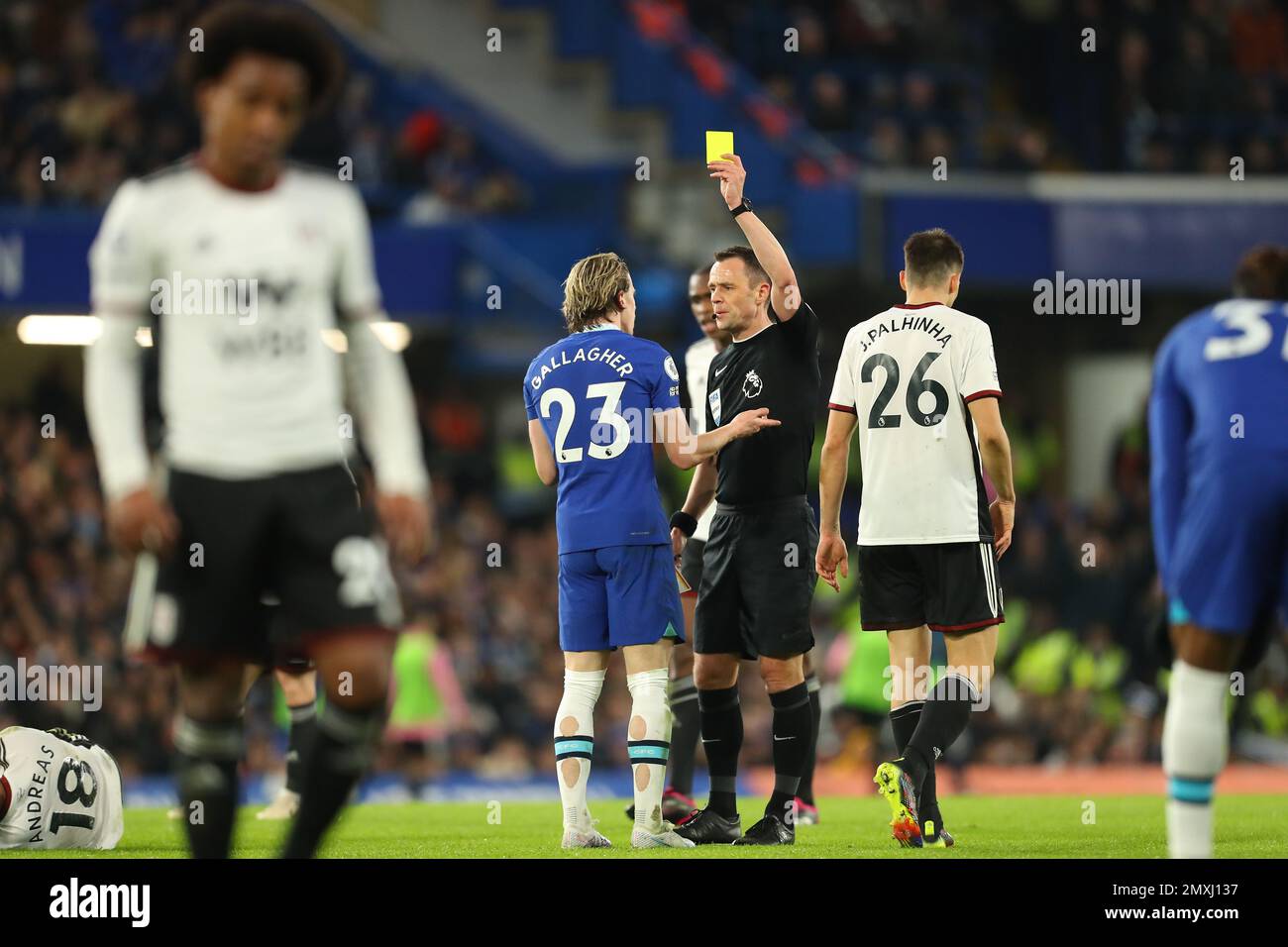 Referee stuart attwell shows a yellow card hi-res stock photography and ...