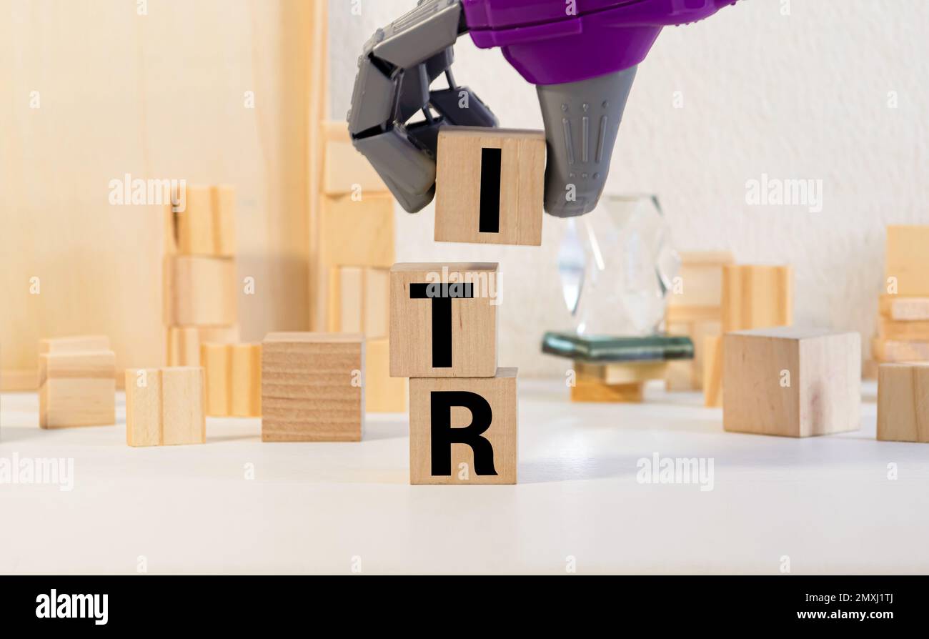 Wooden blocks with the inscription ITR income tax return on office desk ...
