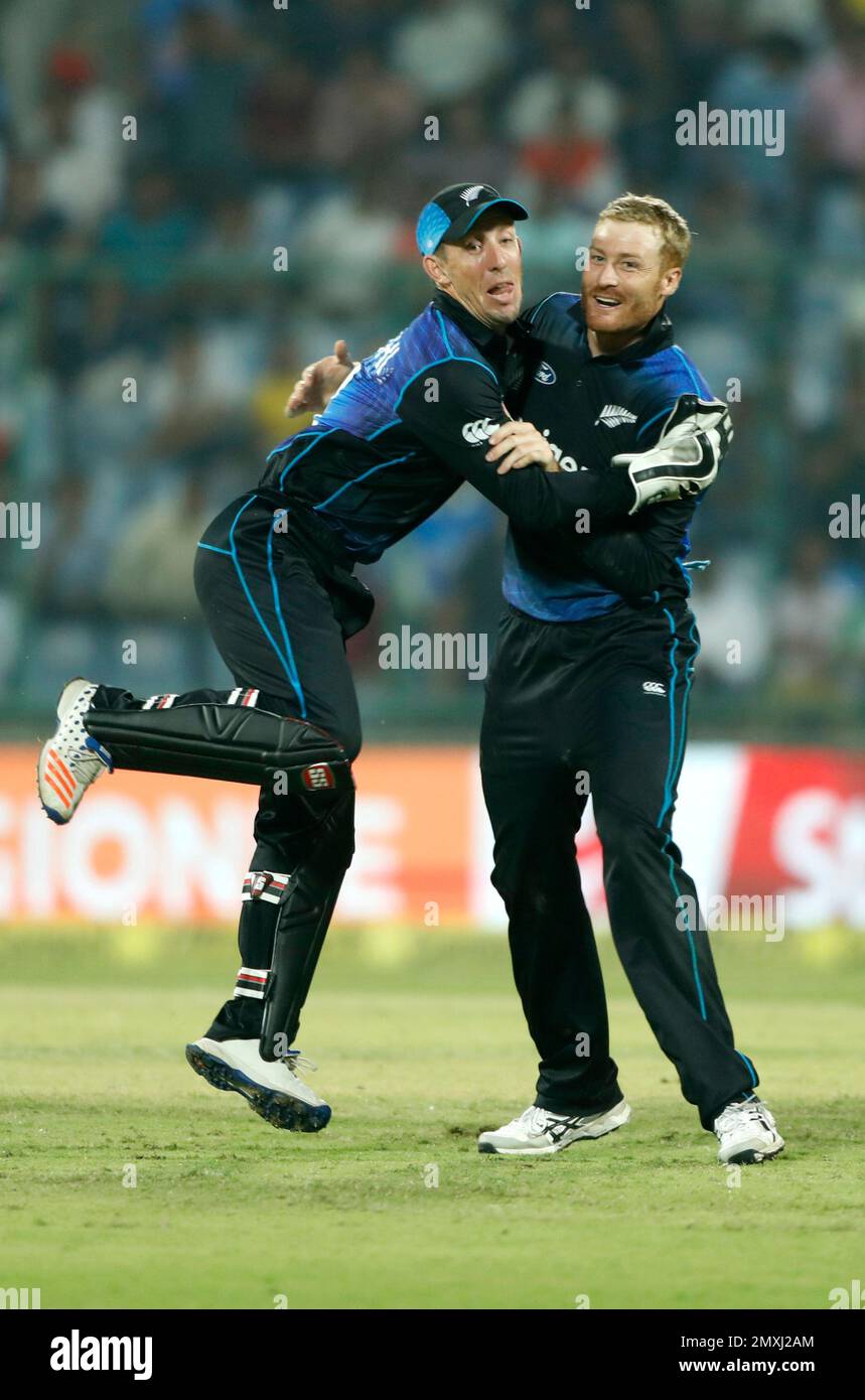 New Zealand's Martin Guptil, right, hugs Luke Ronchi as they celebrates ...
