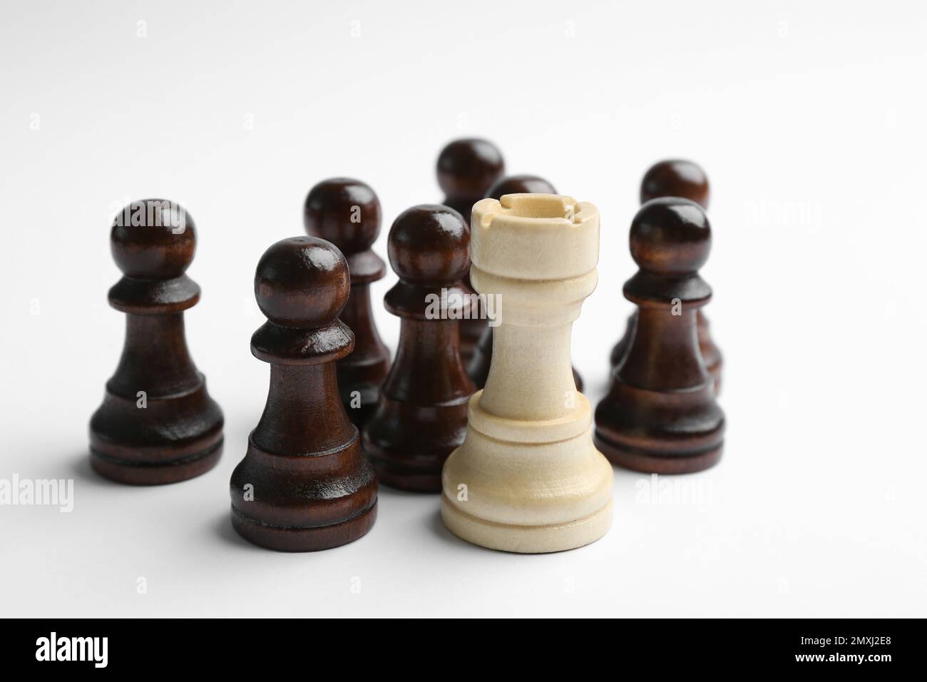 White rook with black pawns on light background. Career promotion ...