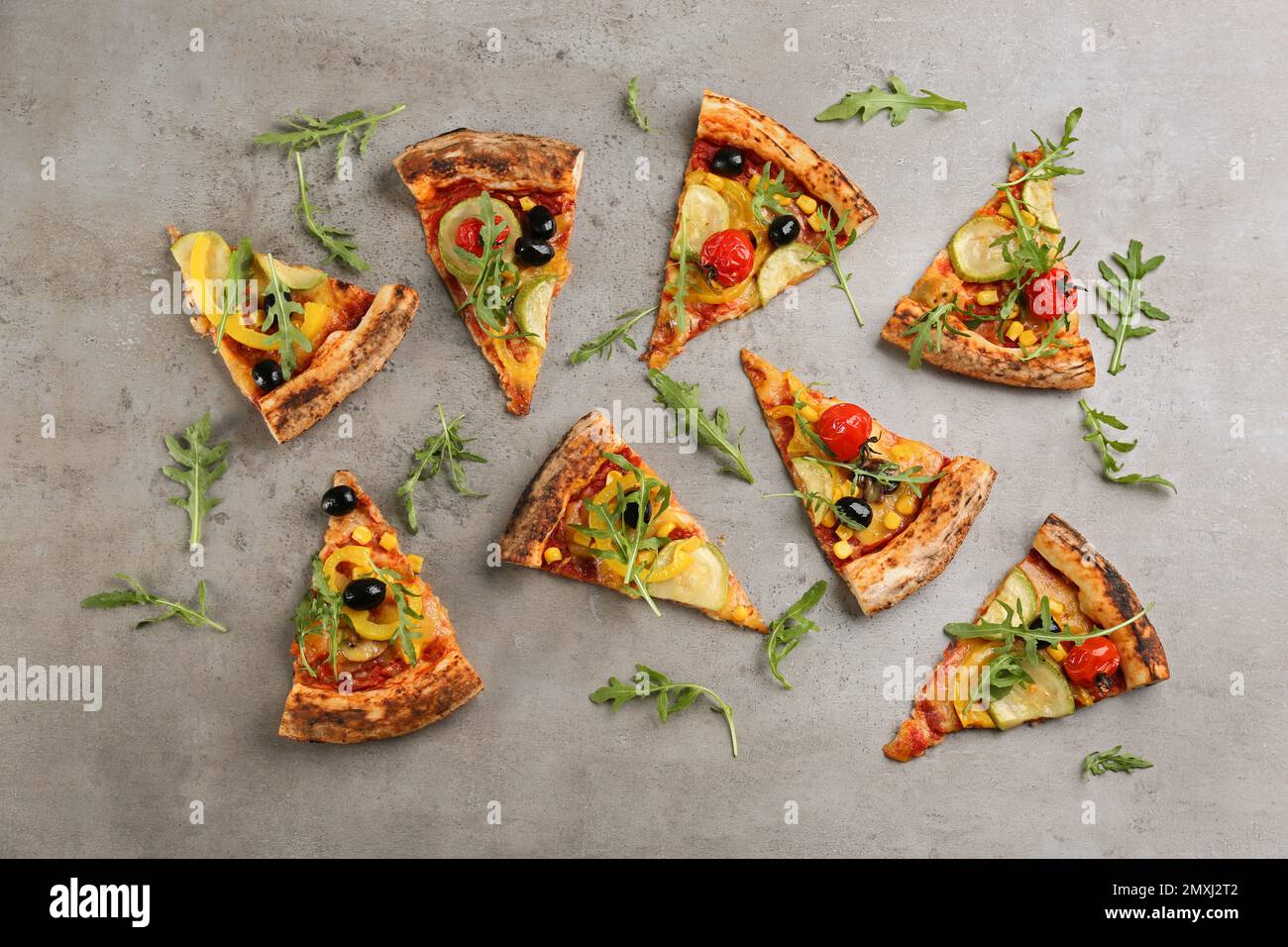 Flat lay composition with vegetable pizza on grey table Stock Photo - Alamy