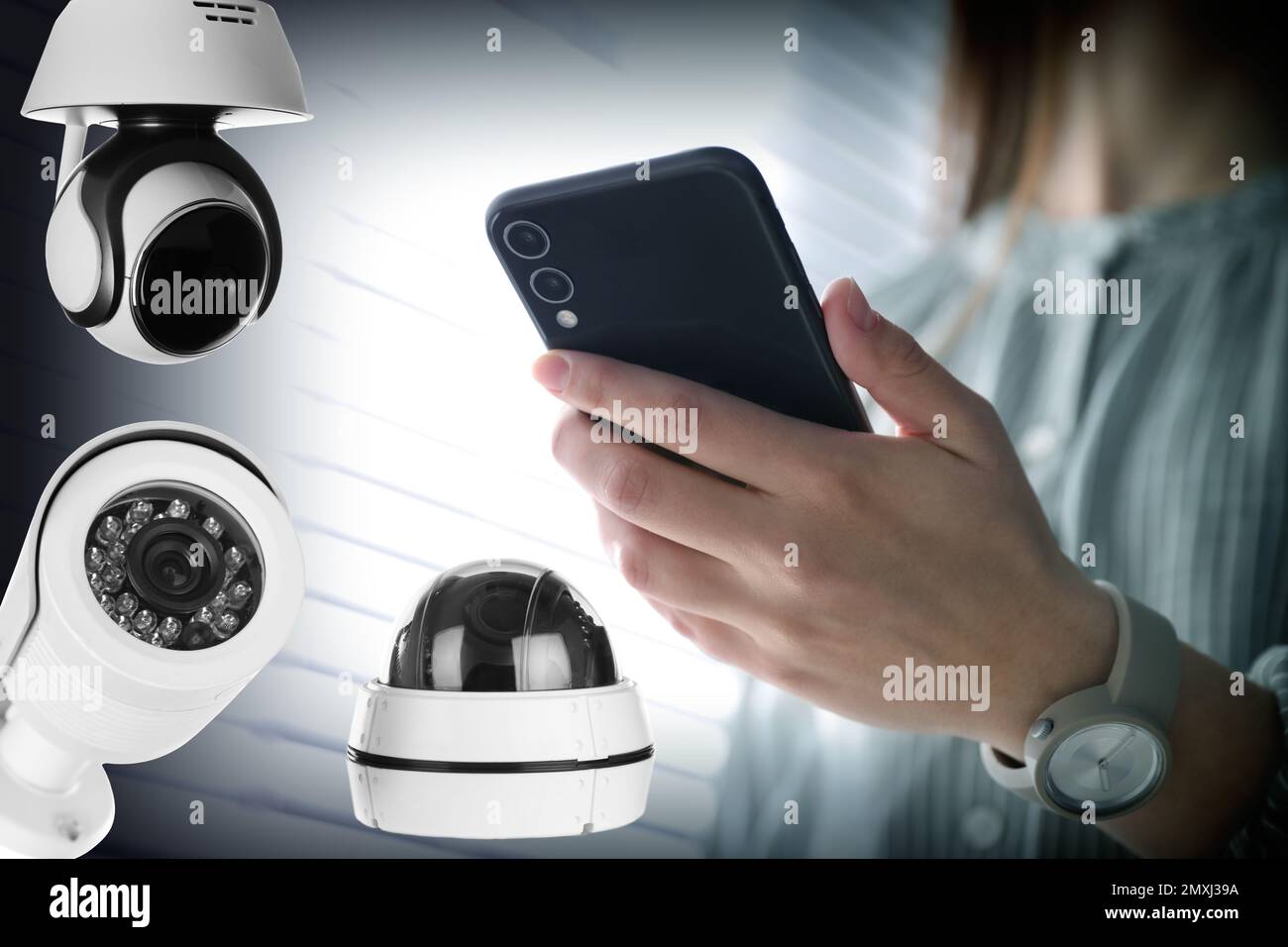 Woman using CCTV app on smartphone indoors, closeup Stock Photo - Alamy