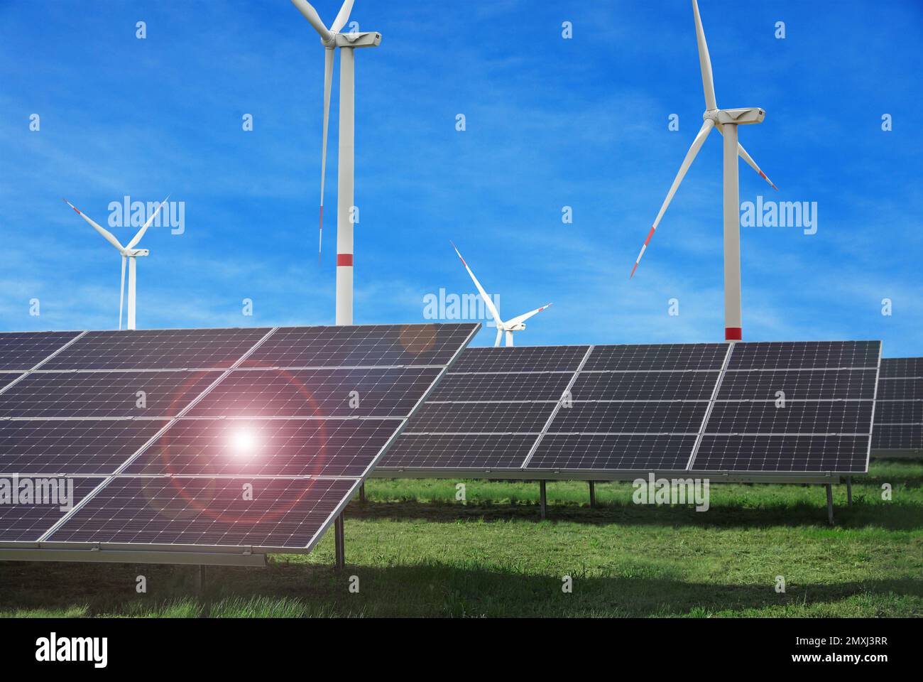 Solar panels and wind turbines installed outdoors. Alternative energy ...