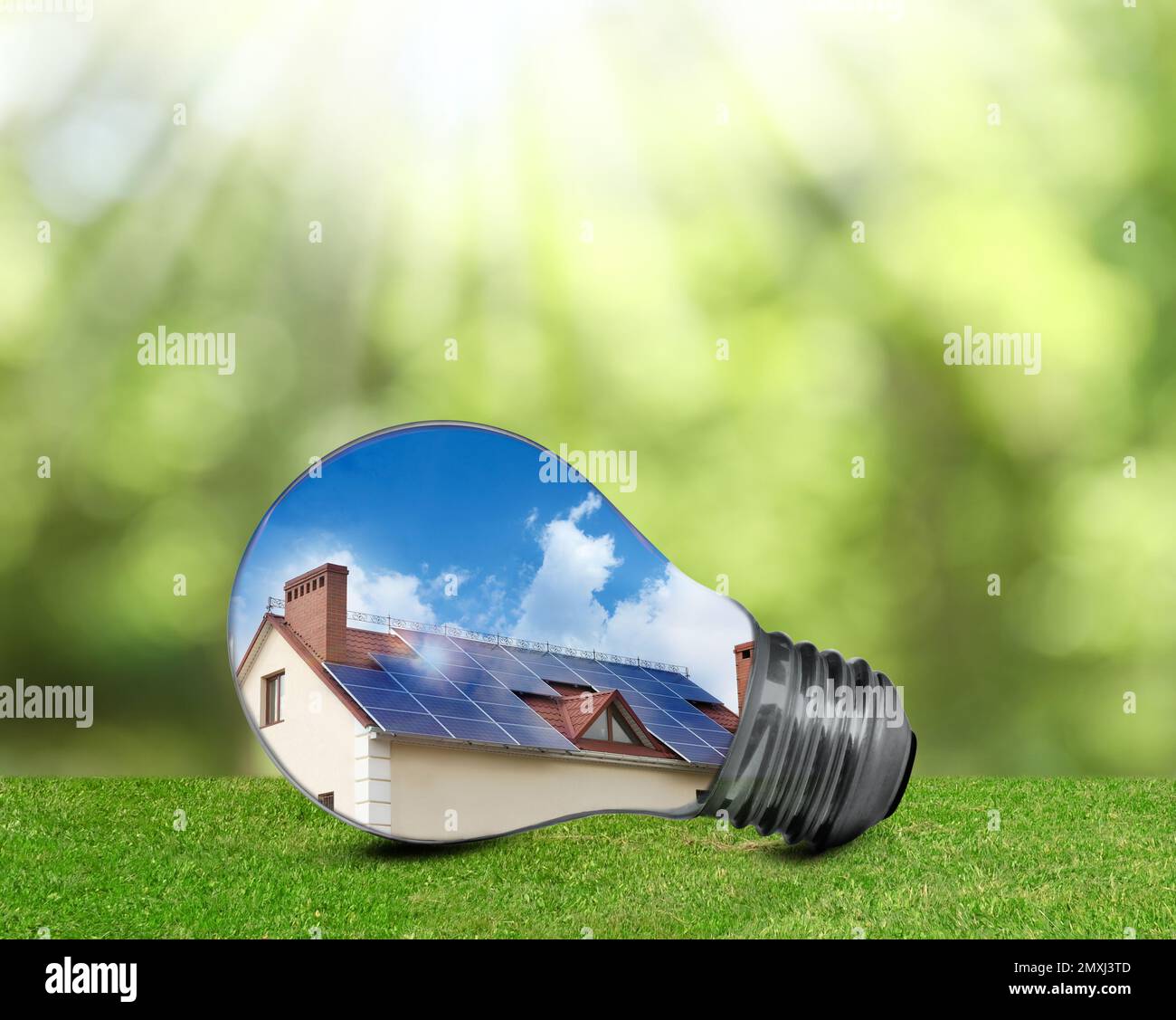 Alternative energy source. Light bulb with solar panels outdoors Stock ...