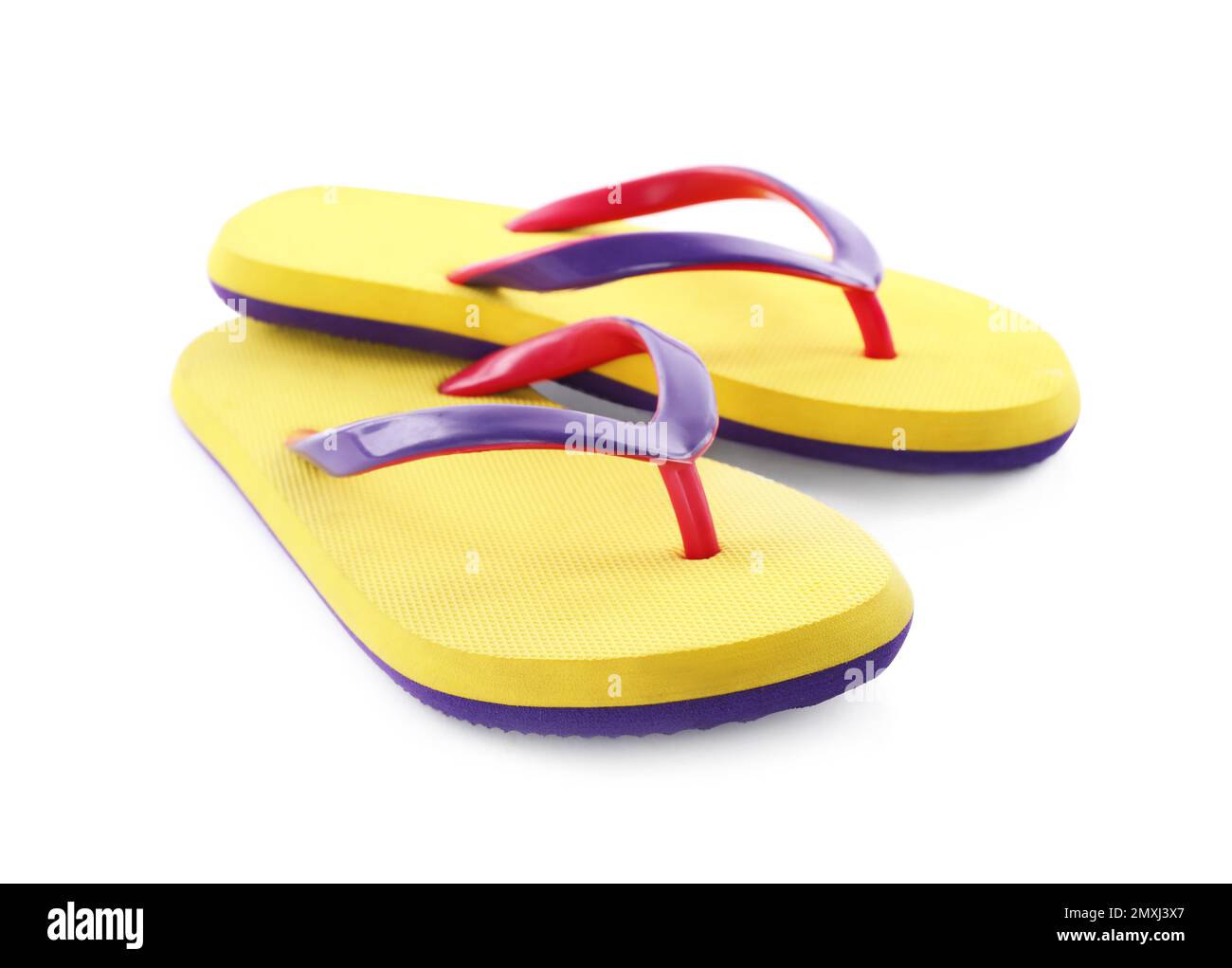 Pair of stylish yellow flip flops isolated on white. Beach object Stock ...