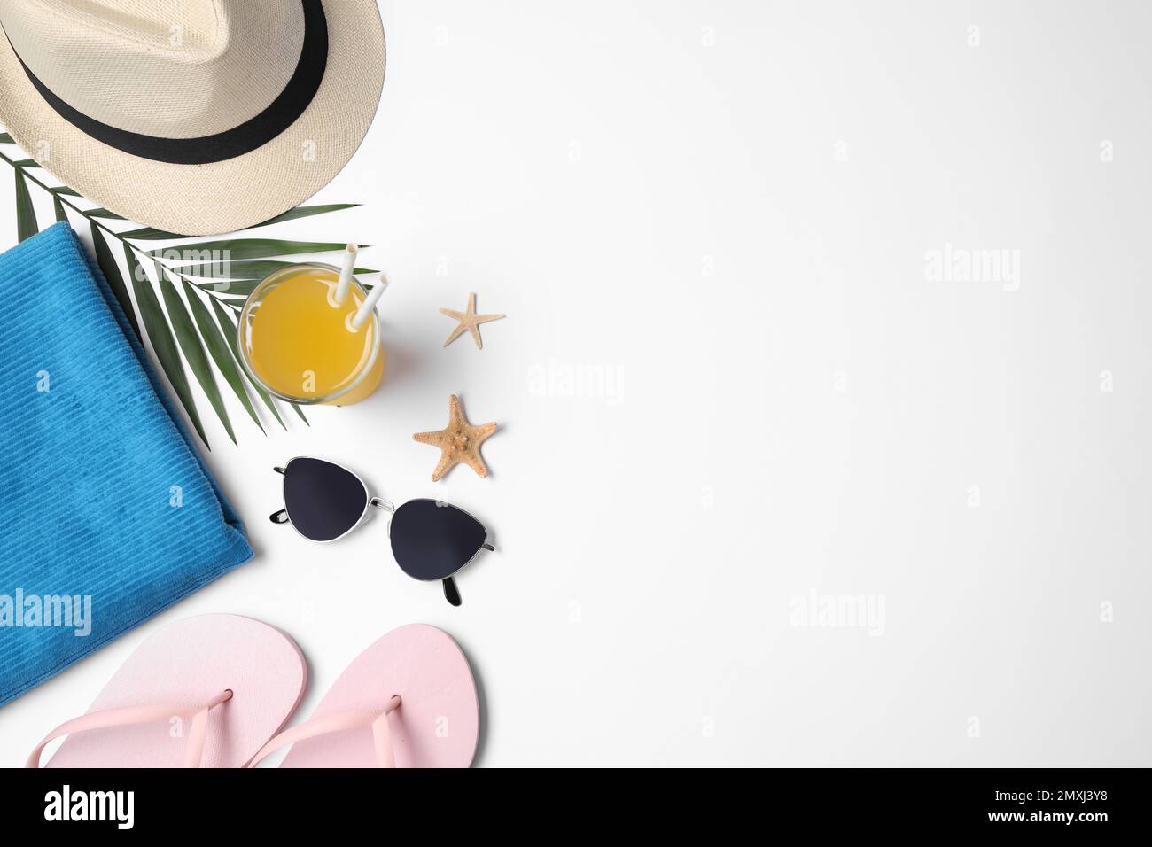 Flat lay composition with beach objects on white background. Space for ...