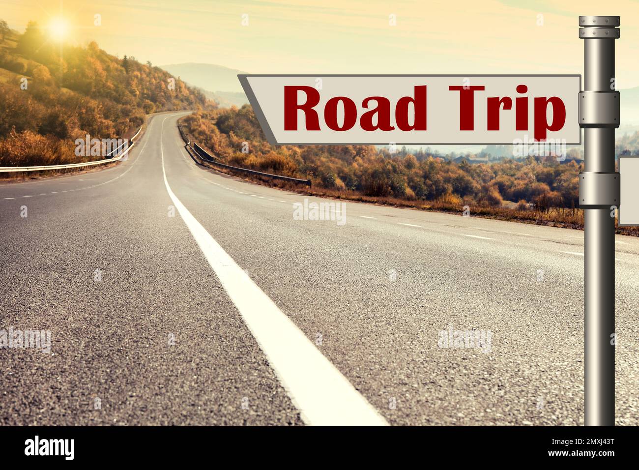 Plaque with inscription road trip on asphalt highway at sunset Stock ...