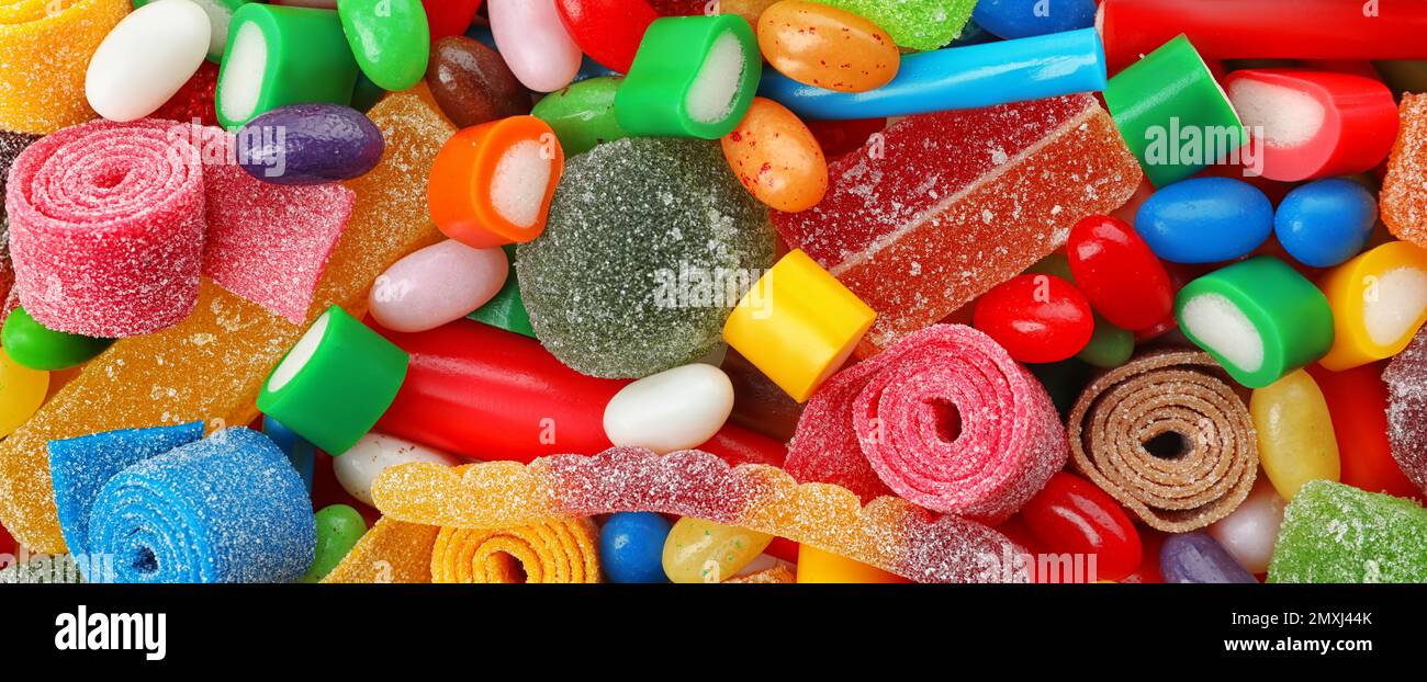 Delicious colorful chewing candies as background, top view. Banner ...