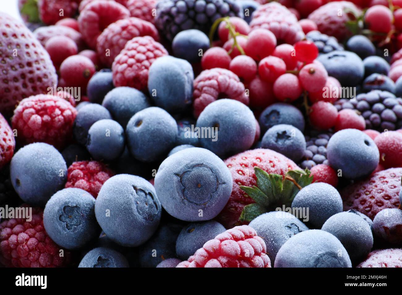 Mix of different frozen tasty berries as background, closeup Stock ...
