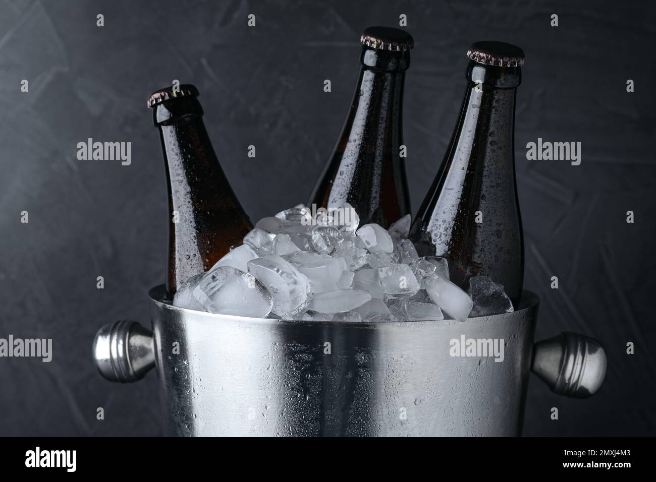 Metal bucket with beer and ice cubes on black background, closeup Stock ...