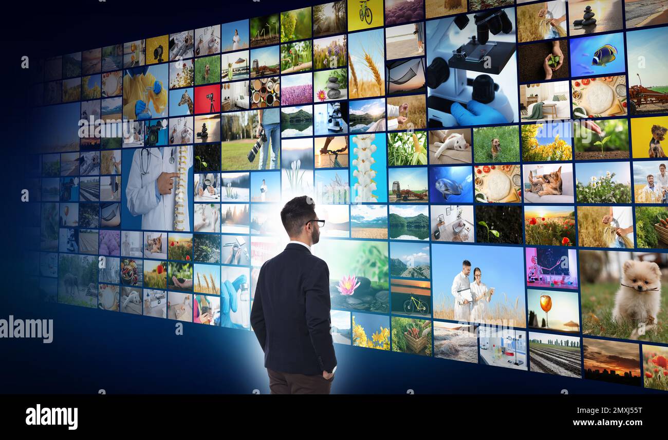 Media library concept. Man using virtual video gallery Stock Photo - Alamy