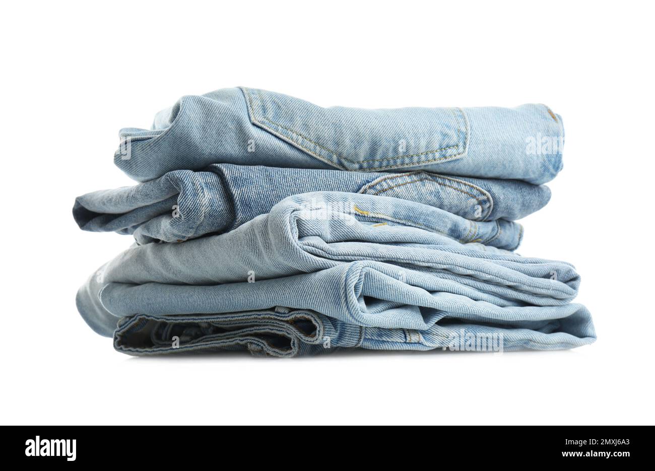 Stack of folded jeans isolated on white Stock Photo - Alamy