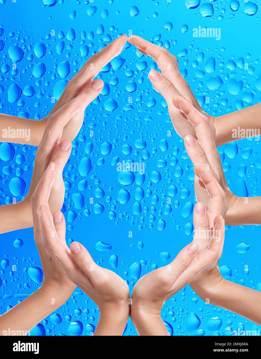 Women forming water drop with their hands on blue background. Ecology ...