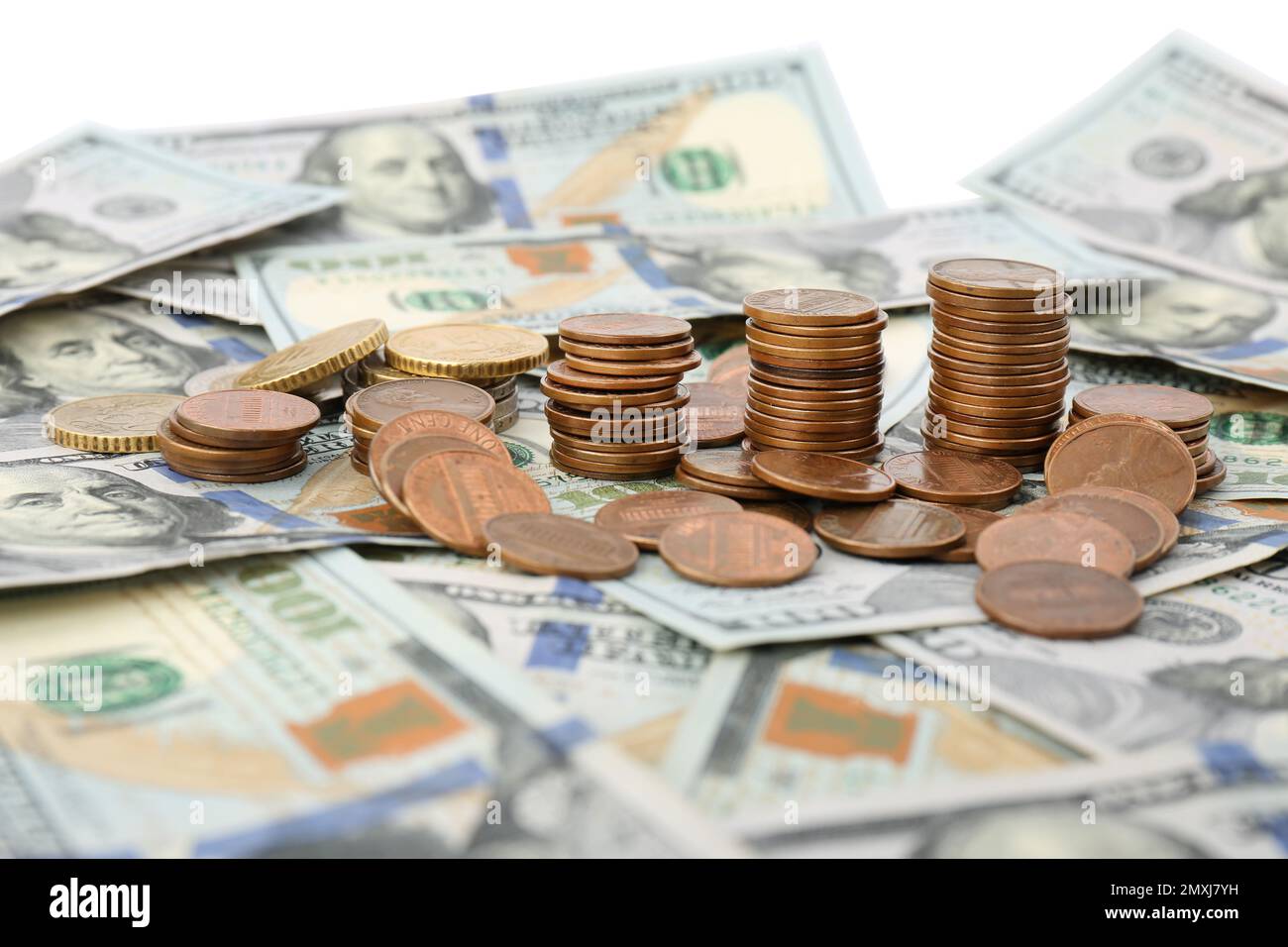Dollar bills and coins on white background Stock Photo - Alamy