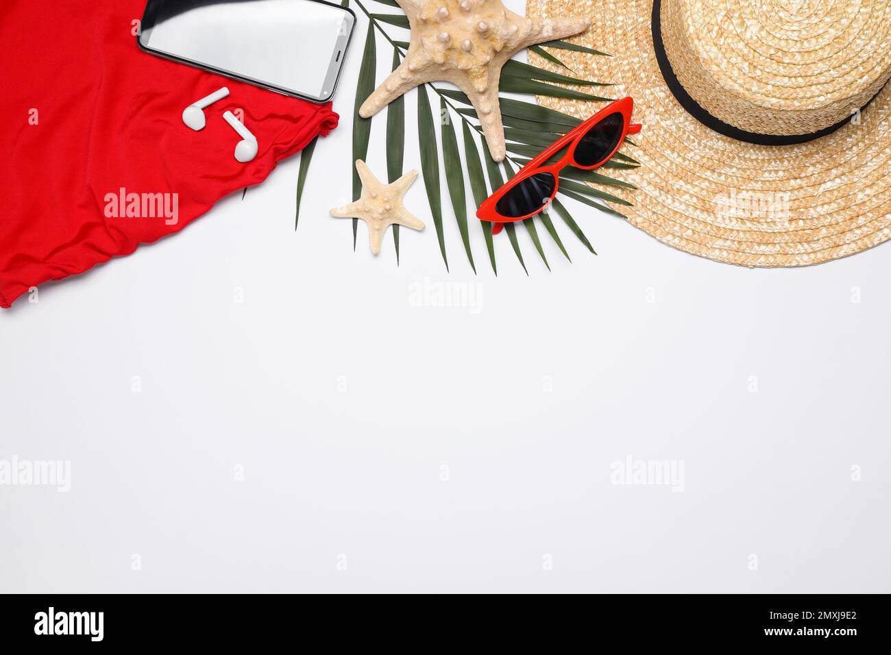 Flat lay composition with beach objects on white background. Space for ...