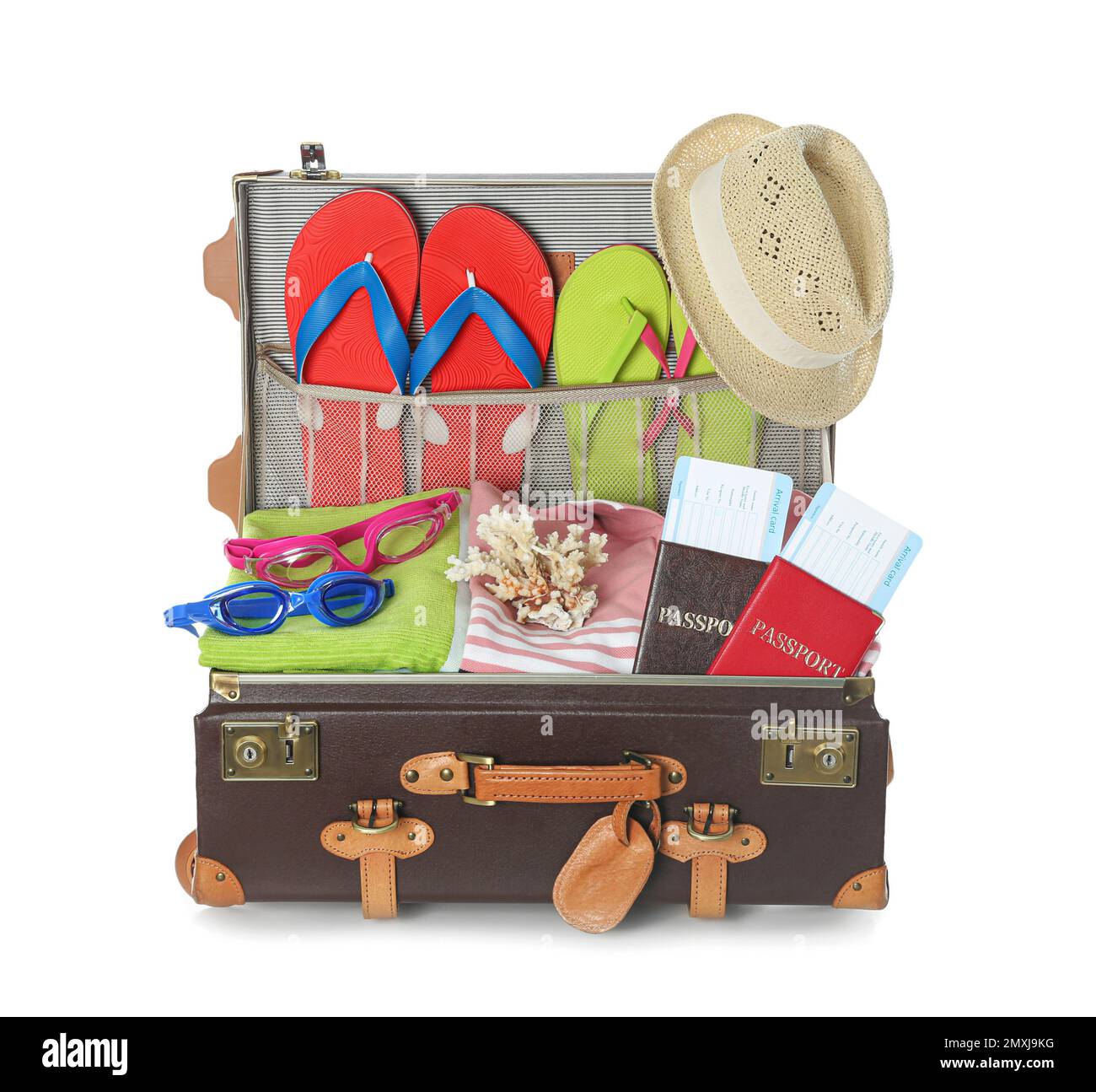 Open vintage suitcase with different beach objects packed for summer ...