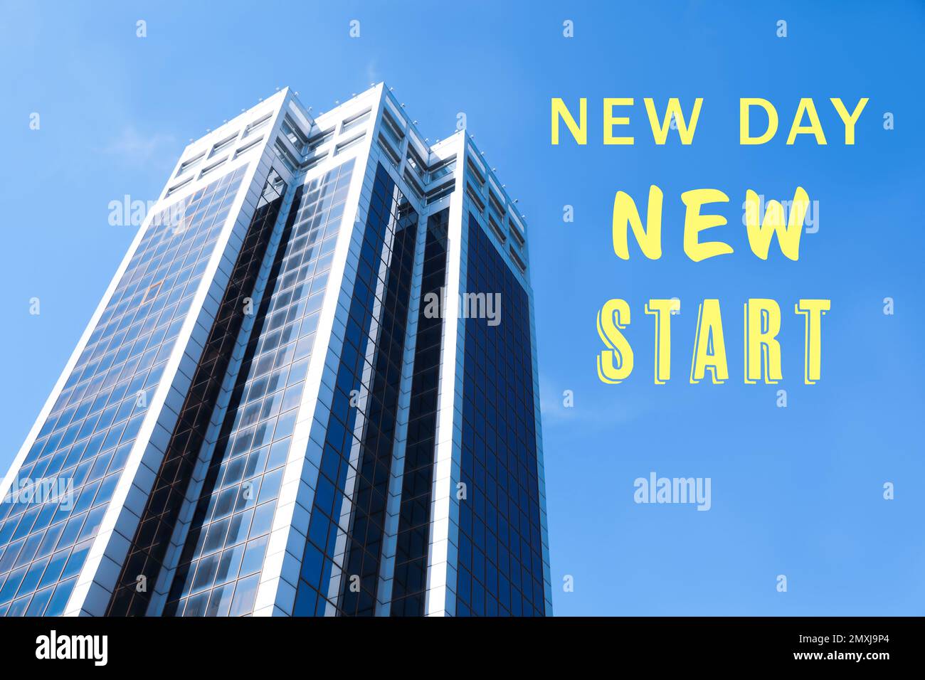 Inspirational text New Day New Start and modern building against blue ...