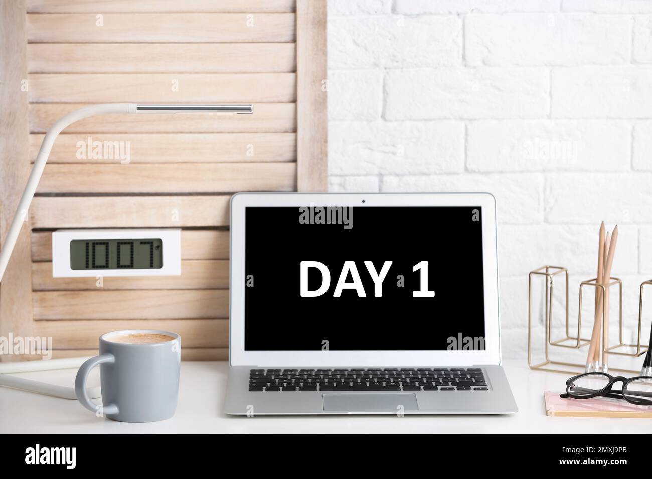 Start new job. Laptop with text Day 1 on screen in modern office Stock ...