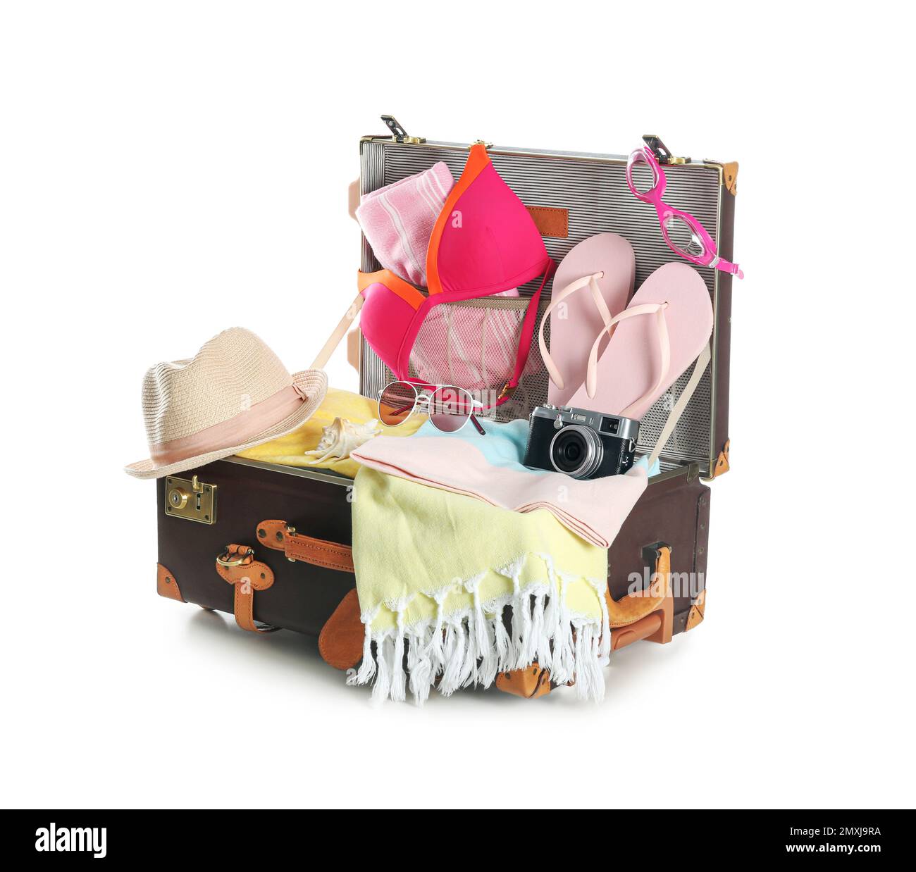 Open vintage suitcase with different beach objects packed for summer ...