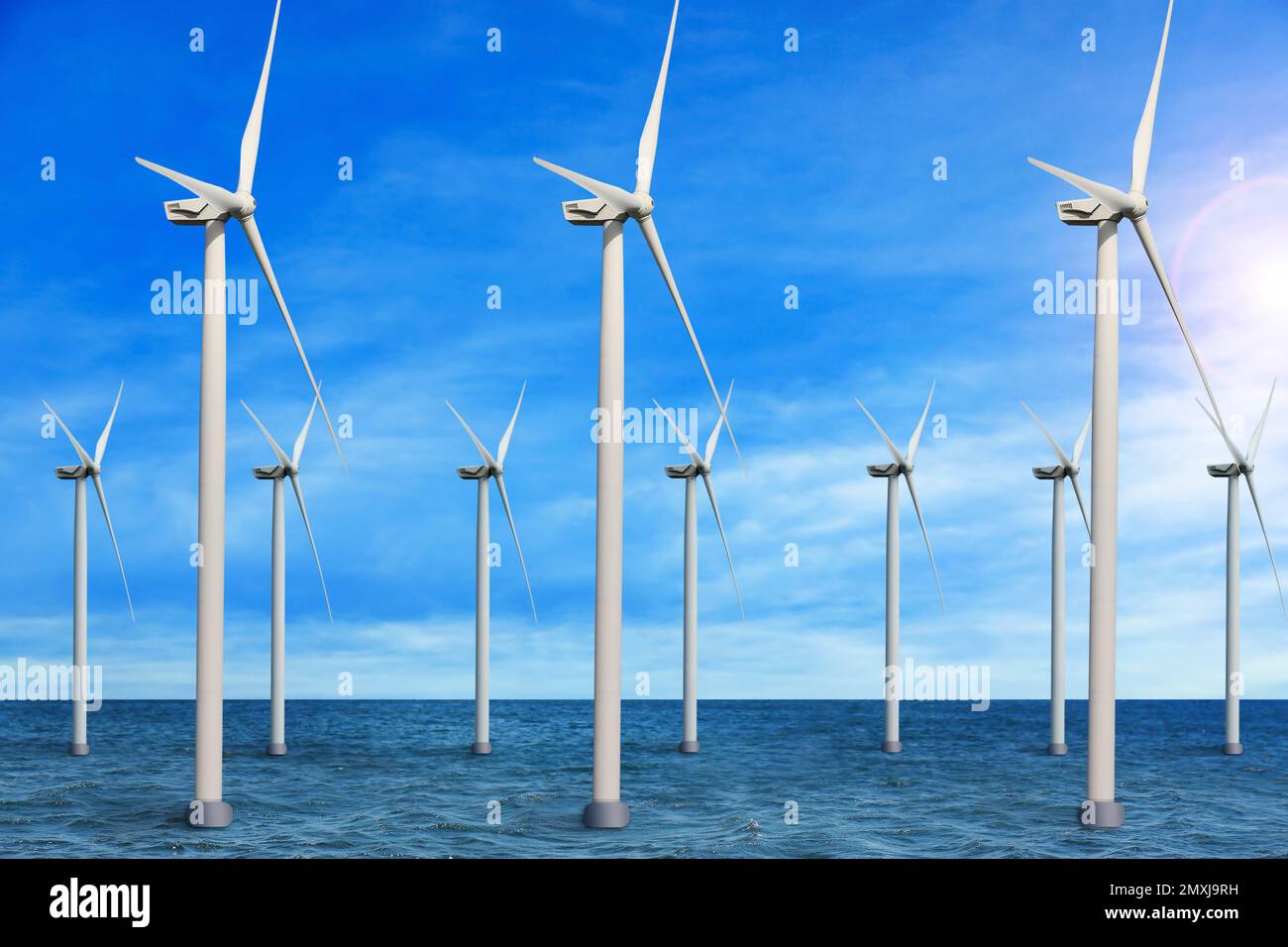 Floating wind turbines installed in sea under blue sky. Alternative ...