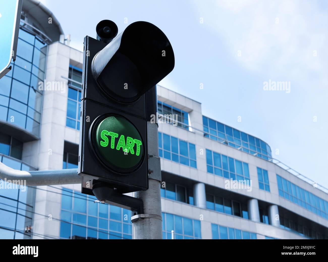 New opportunities. Traffic light with green signal and word Start on ...
