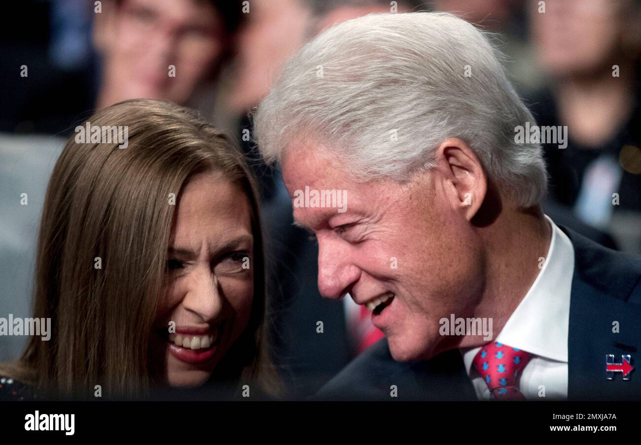 Former President Bill Clinton, right, speaks to his daughter Chelsea ...