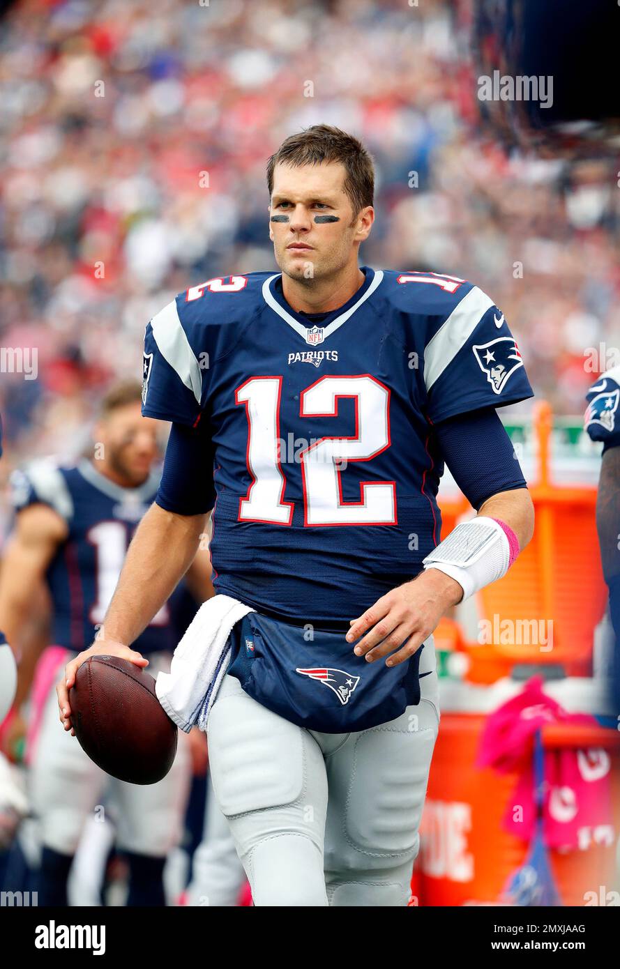 New England Patriots quarterback Tom Brady holds a ball on the ...