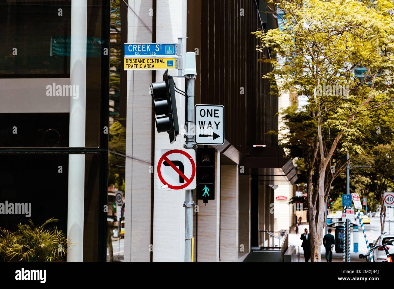 The column with street signs and traffic lights on the sidewalk Stock ...