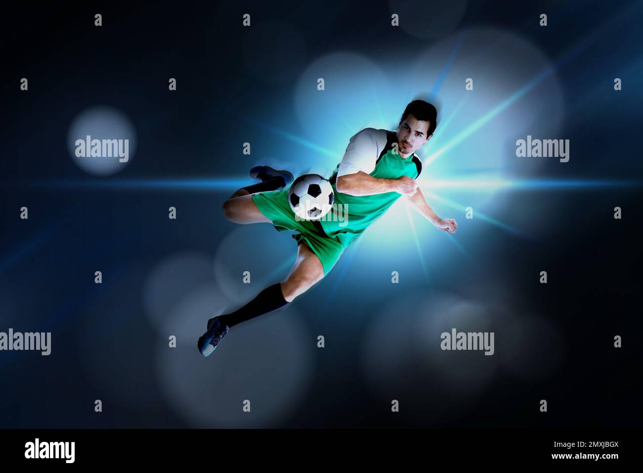 Shot of football player in action. Creative design Stock Photo - Alamy