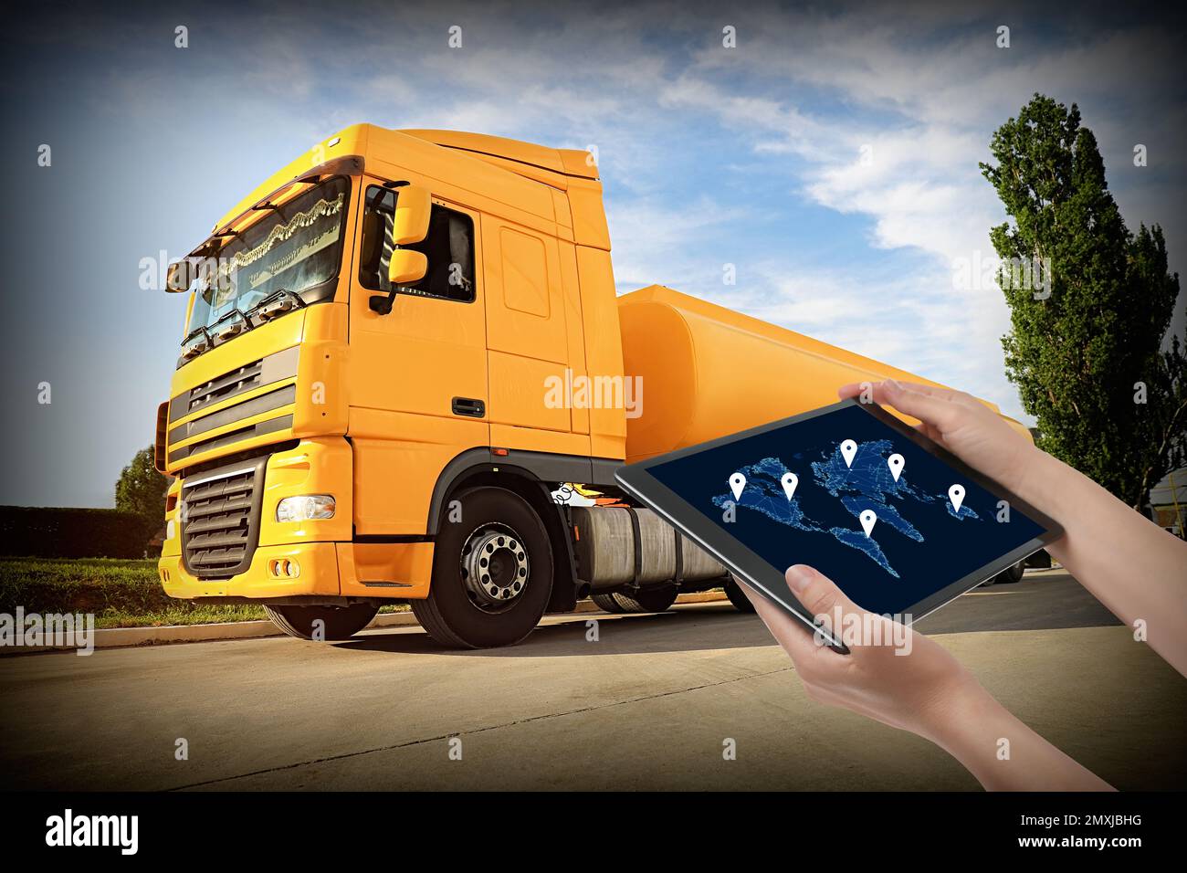 Logistics concept. Woman using tablet with world map on screen against ...