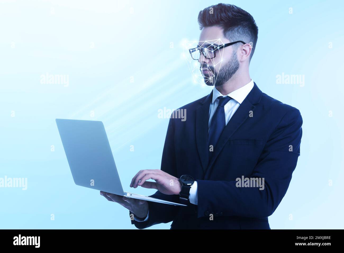 Facial recognition system. Man using laptop on light blue background ...
