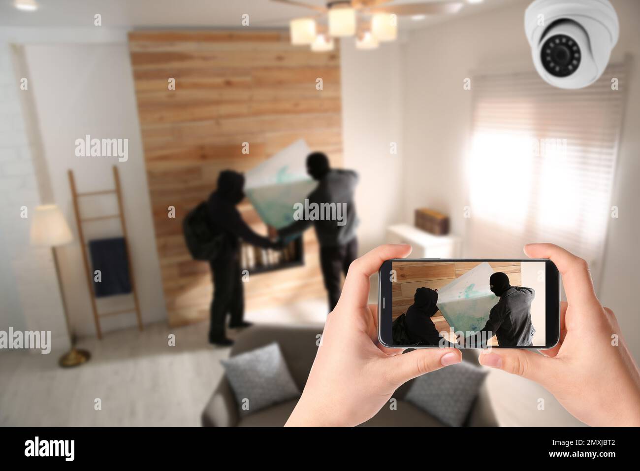 Man monitoring situation at his house with CCTV app on smartphone ... Man monitoring situation at his house with CCTV app on smartphone ...