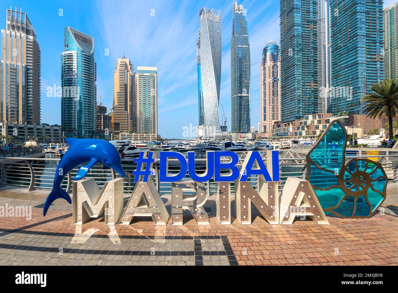 The blue and white letter logo sign at the entrance of the Dubai Marina ...
