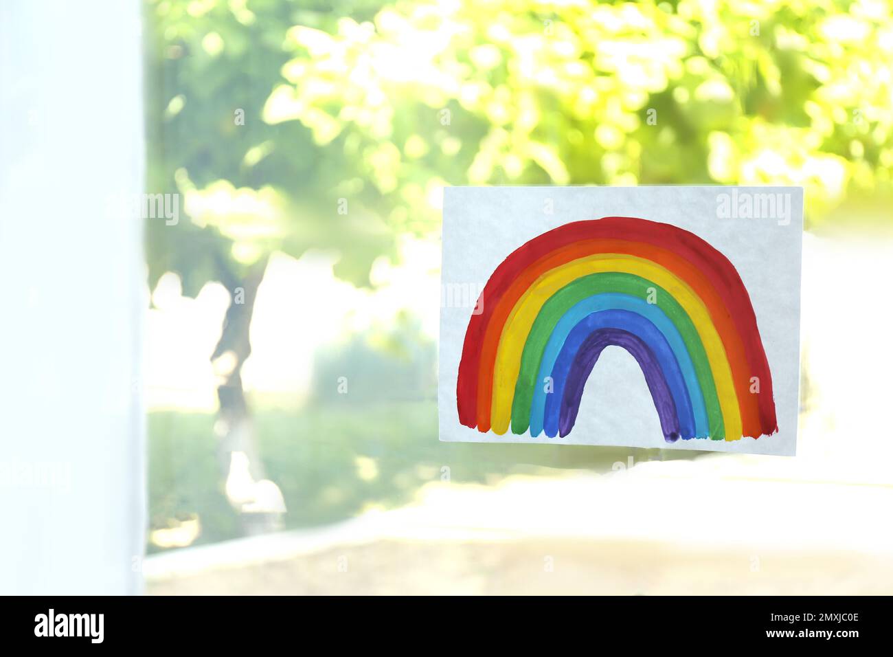 Picture of rainbow on window glass indoors. Stay at home concept Stock ...